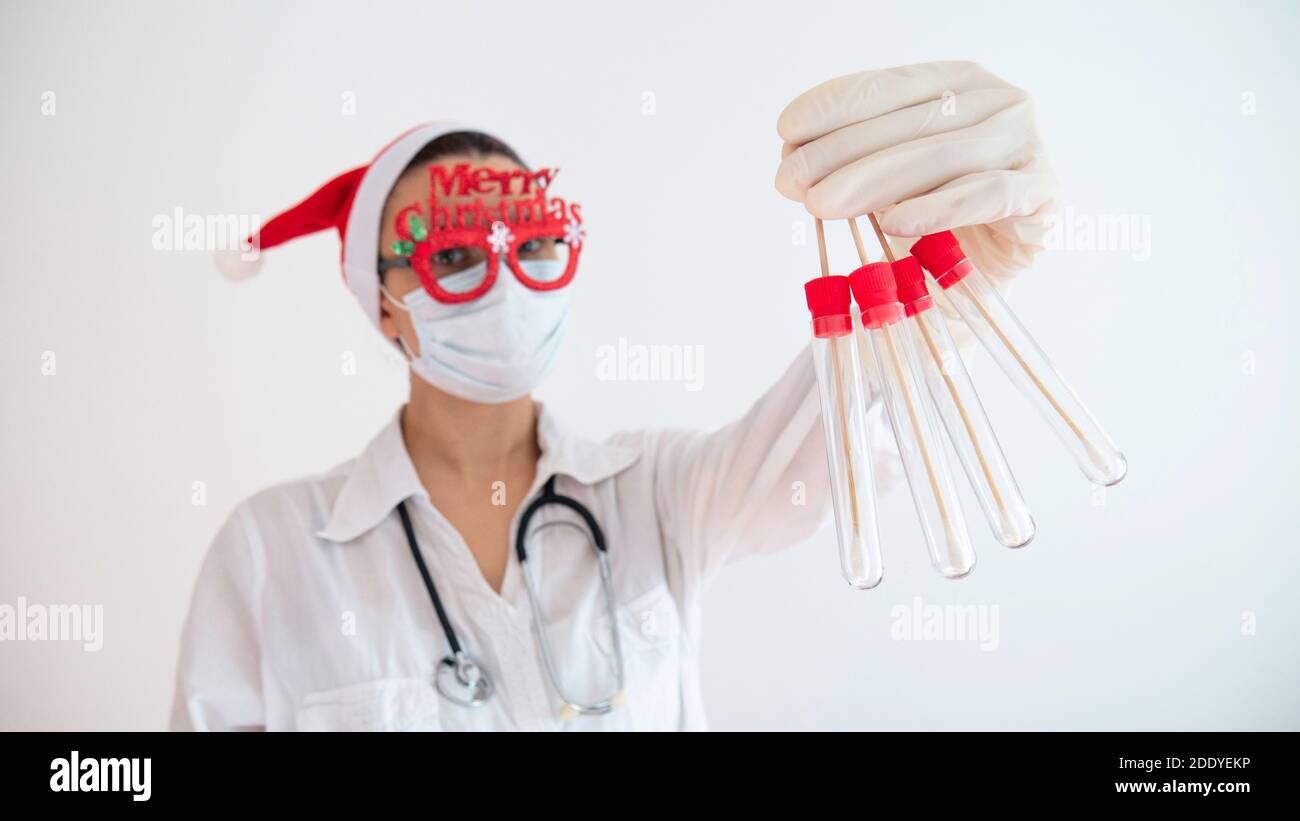 Woman doctor with Santa Claus Hat and Glasses Merry Christmas holding ...