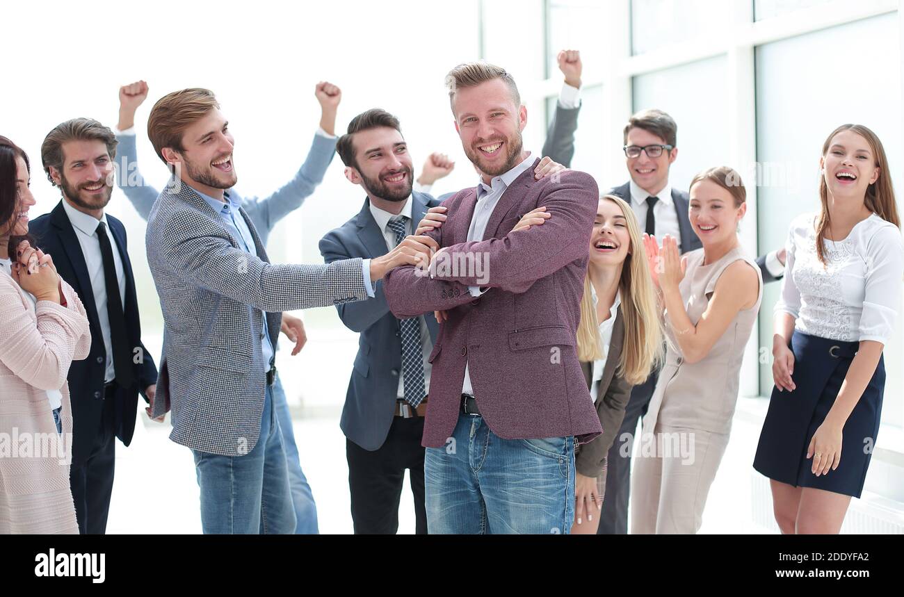 creative team congratulating their leader. success concept Stock Photo ...