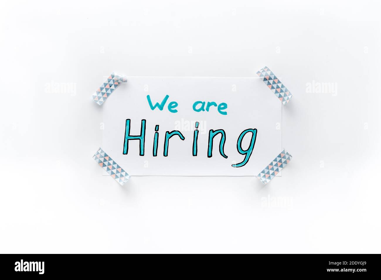 We are hiring - job recruting concept. Words We are hiring on paper ...