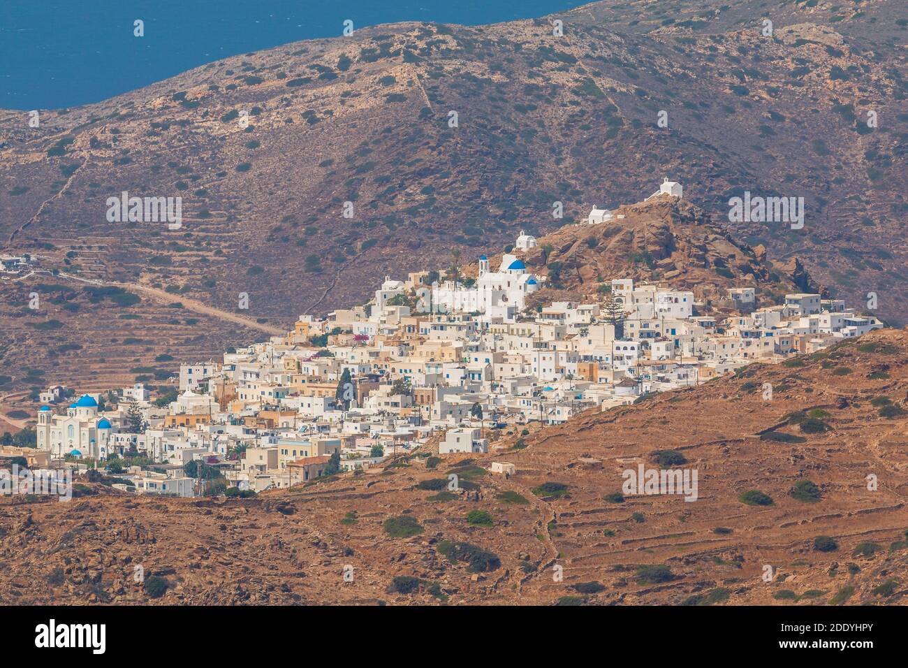 View of the Chora, old town and Aegean Sea, mountain around. Ios Island ...
