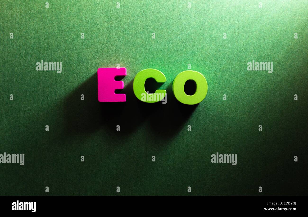 Word text Eco spelling by wooden colorful abc letters at green craft ...