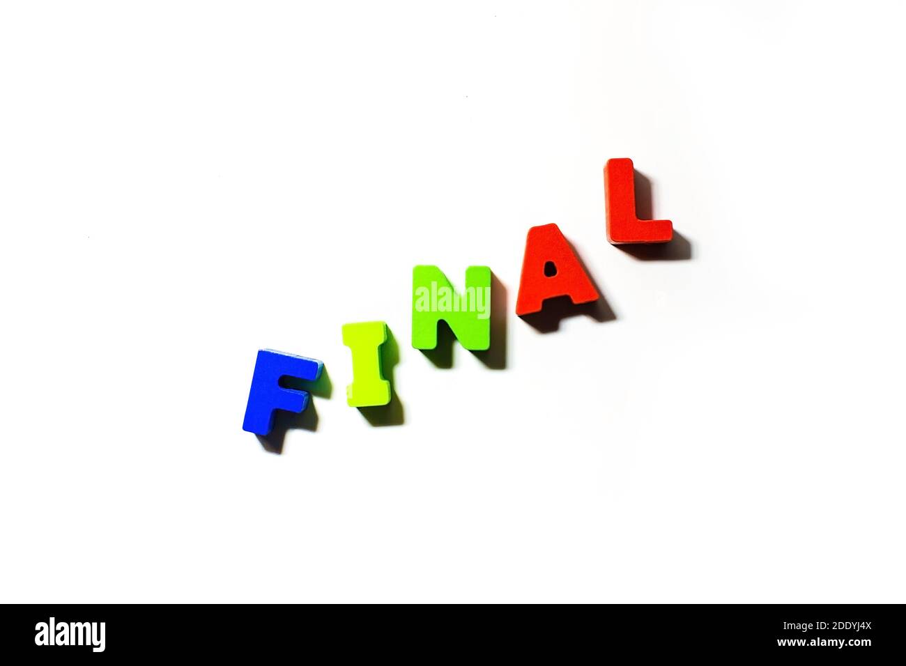 Final word text inscription from wooden colorful letters at white ...