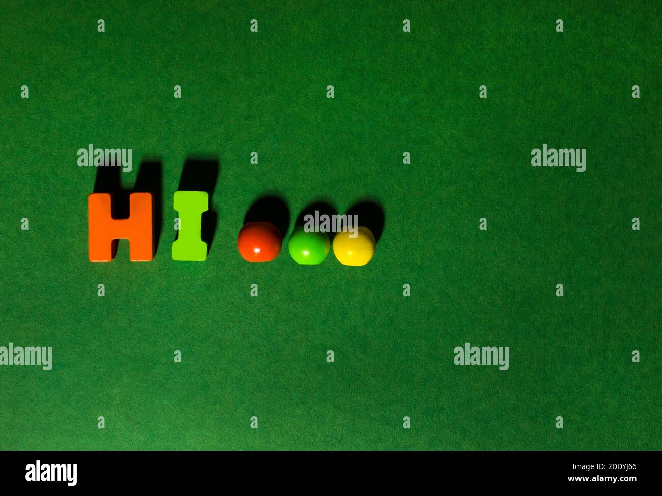 Colorful wooden letters text word Hi inscription with ellipsis beads at ...