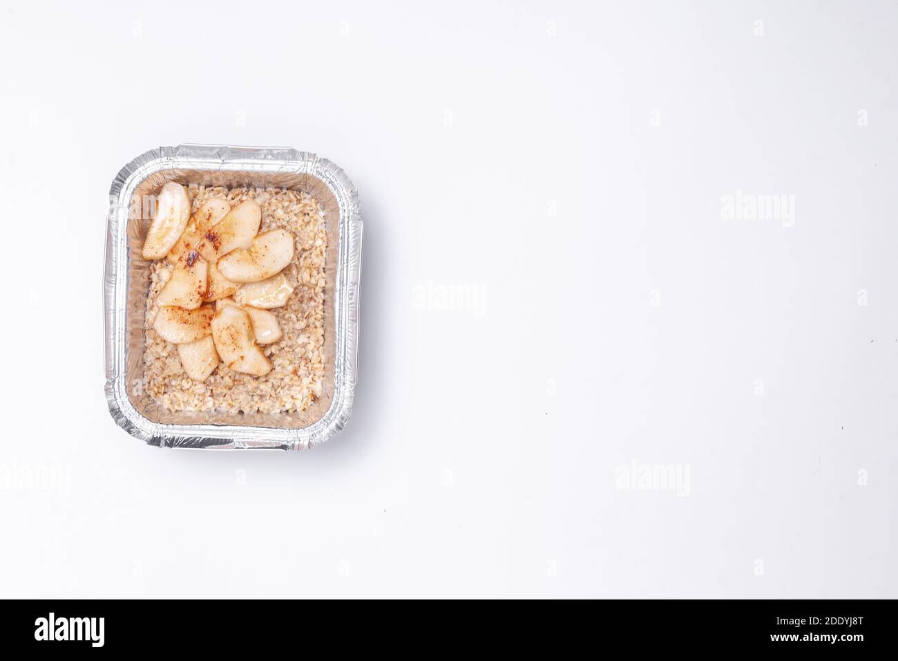 healthy food delivery or takeaway lunch box with oatmeal and apple in ...