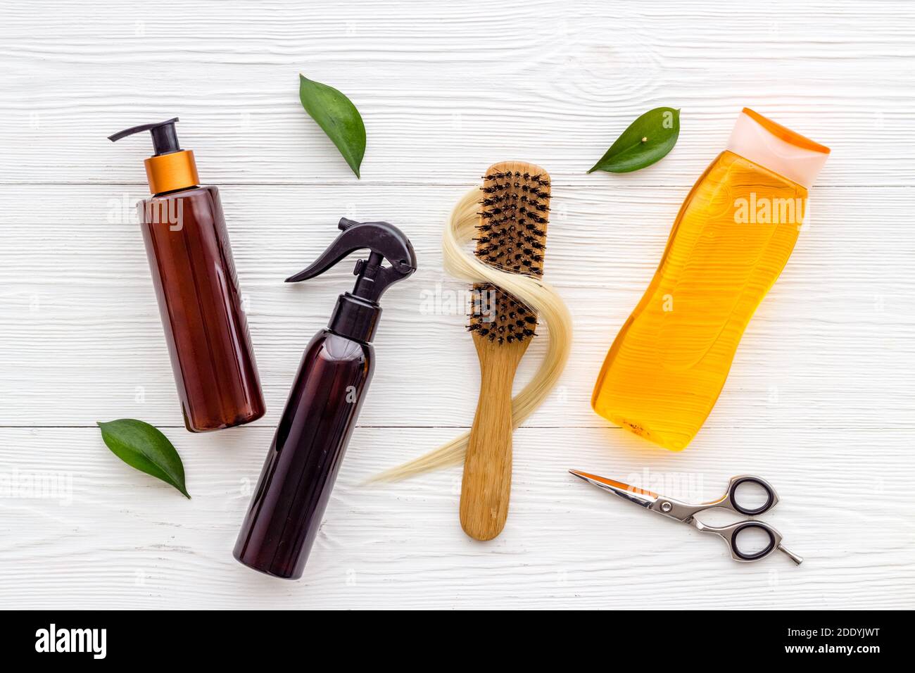 Hairdresser scissors with comb and srrand of blond hair and comb, top ...