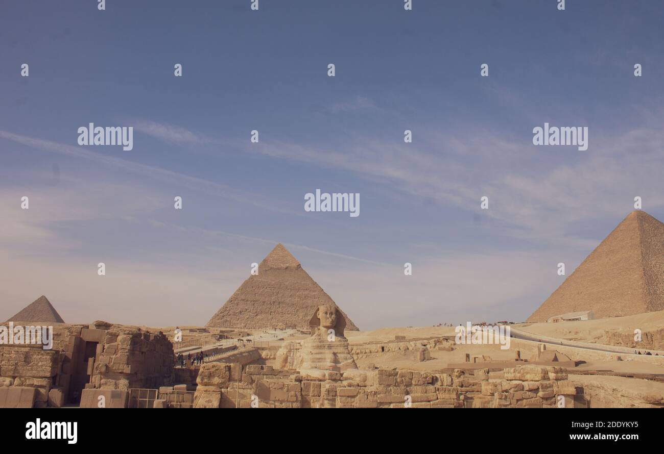 Landscape of Sphinx and pyramids behind Stock Photo - Alamy