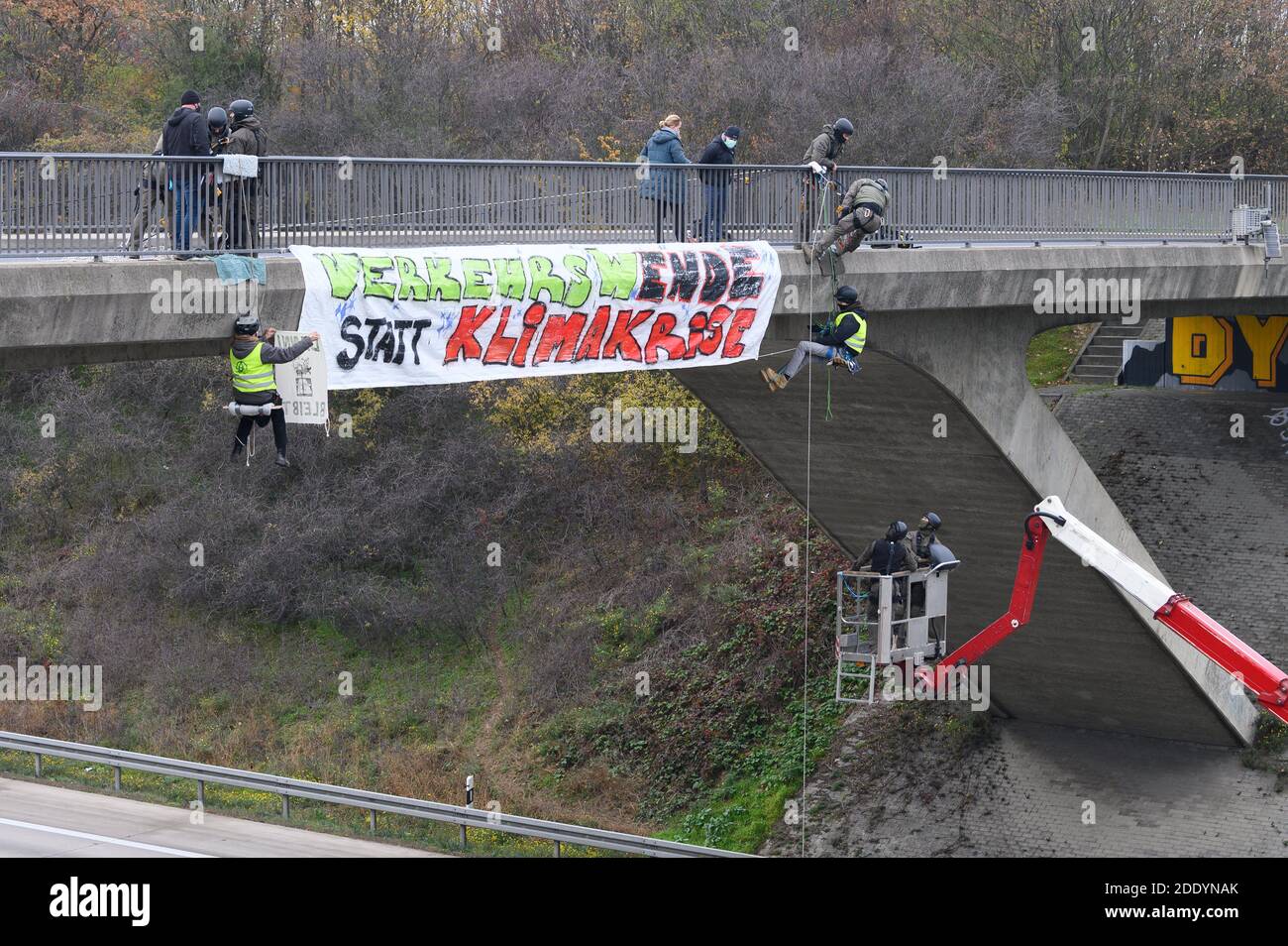 Dresden, Germany. 27th Nov, 2020. Climate activists are hanging from a ...