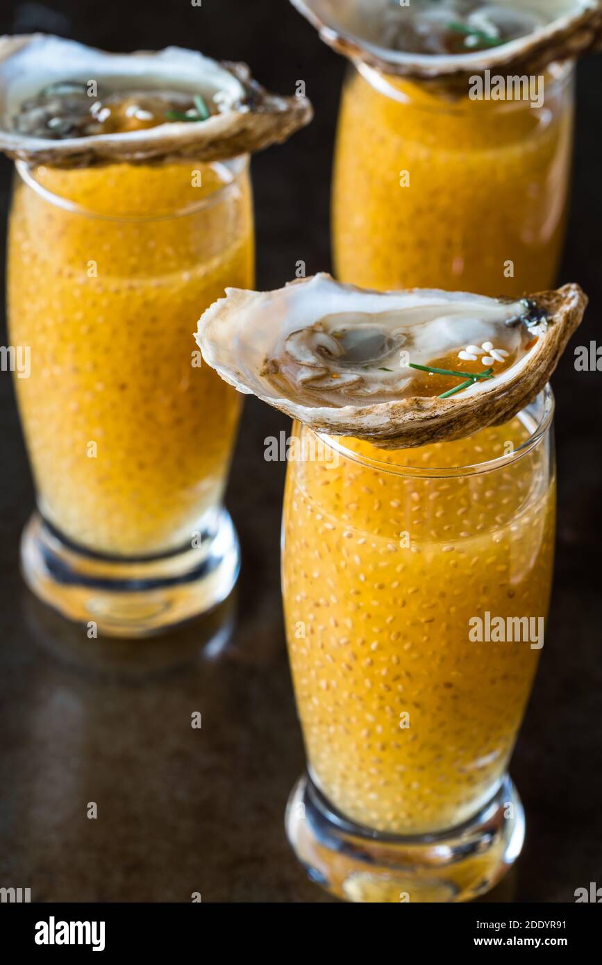 Mango Chai Rum Shooters with Oysters Stock Photo - Alamy