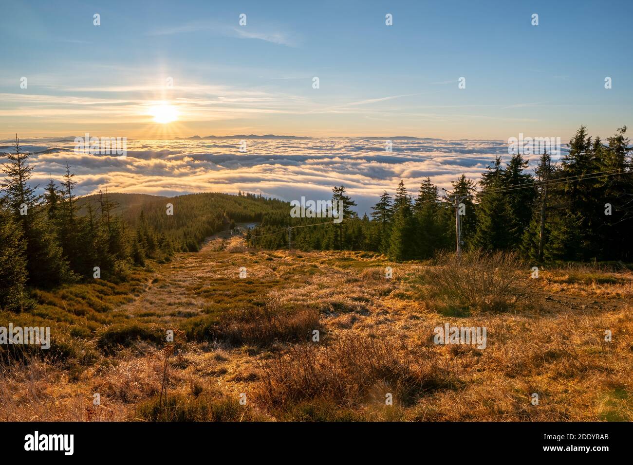 Inversion in the valley during sunrise with mountain ridge in the ...