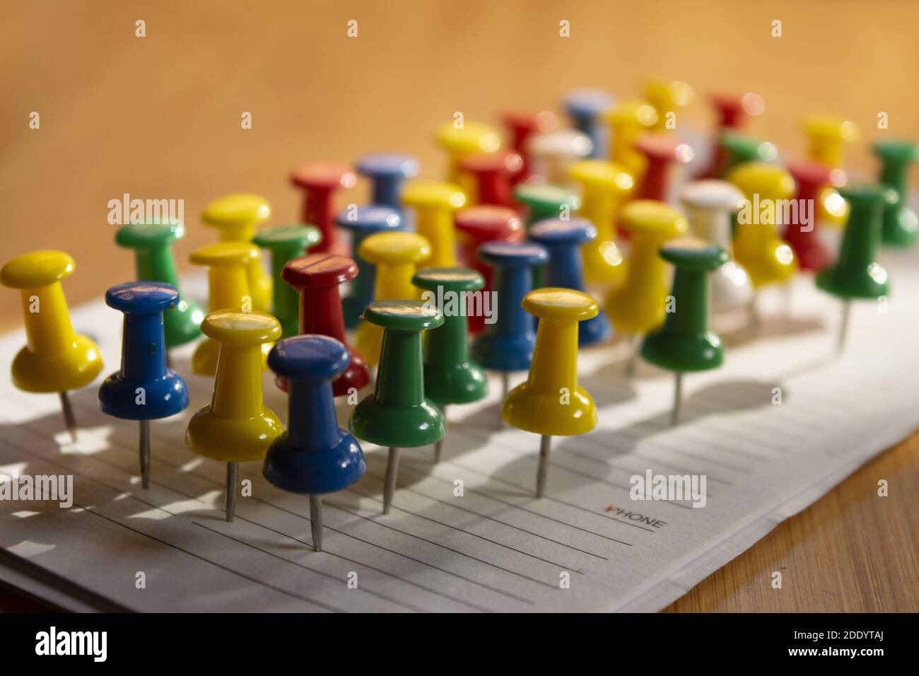 variety of colored drawing pin on a paper note Stock Photo - Alamy