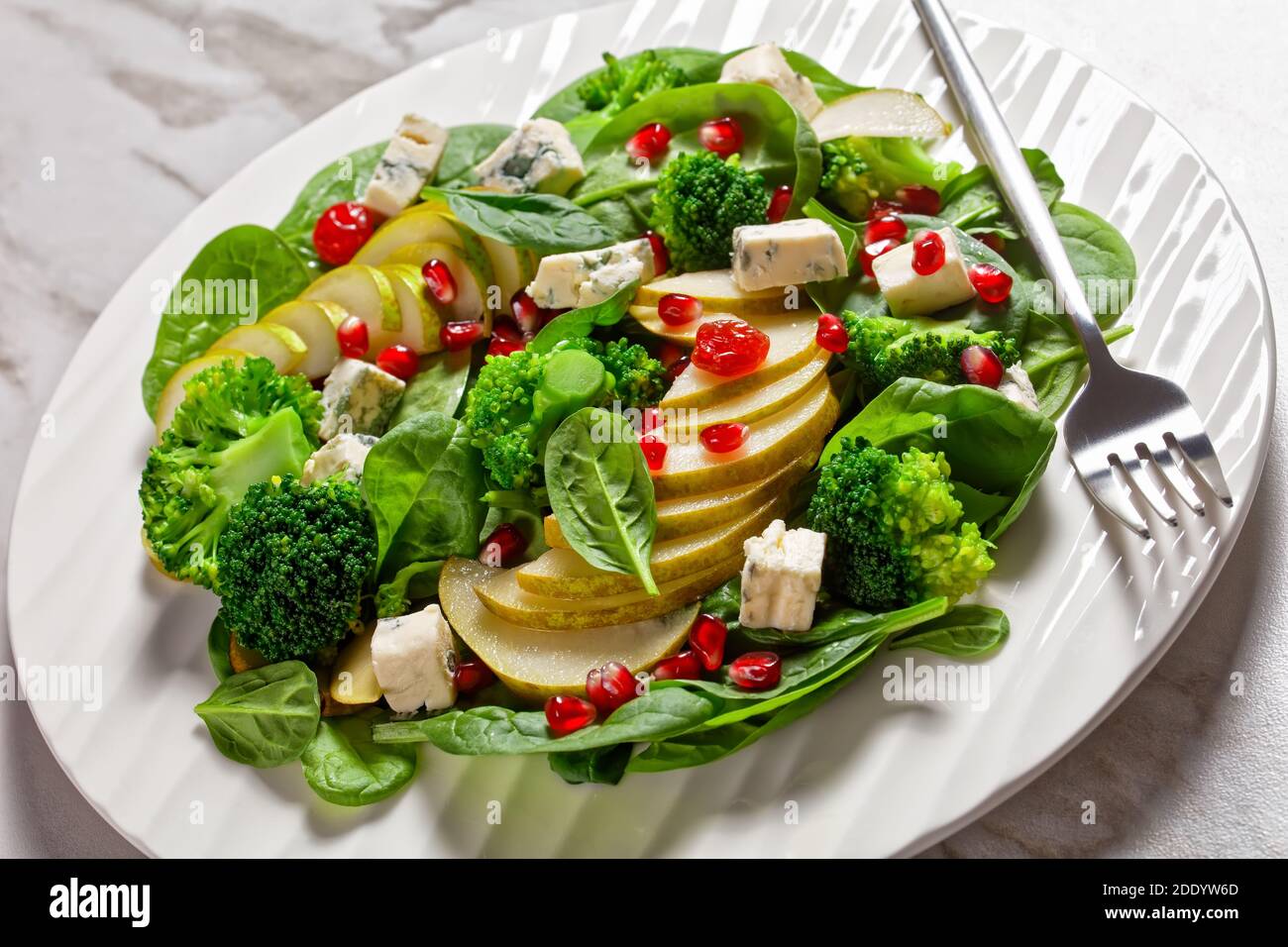 pear salad with blue cheese cubes, broccoli, spinach, dried cranberry ...