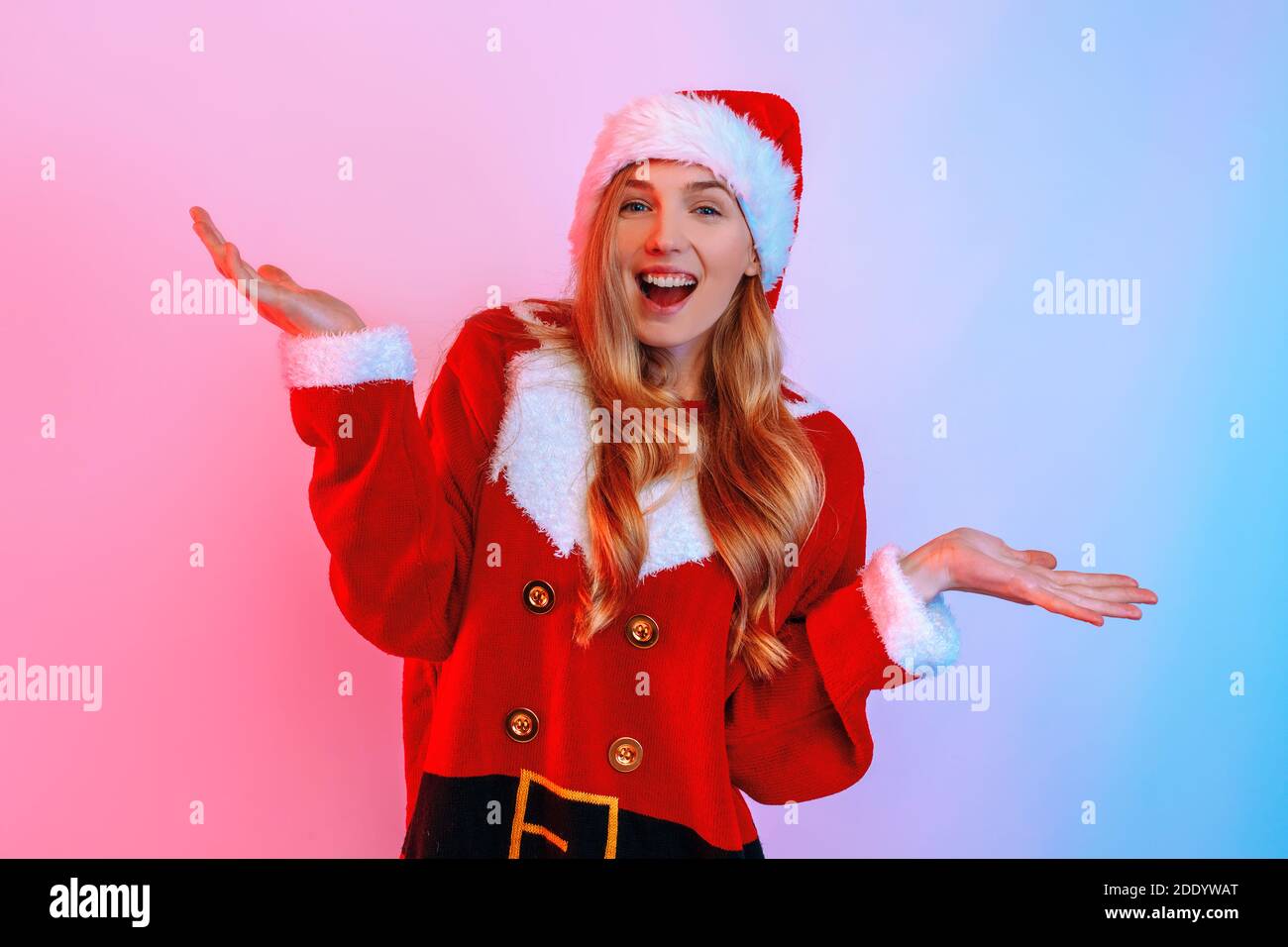 Portrait of a gorgeous charming confused girl, in a Christmas sweater ...