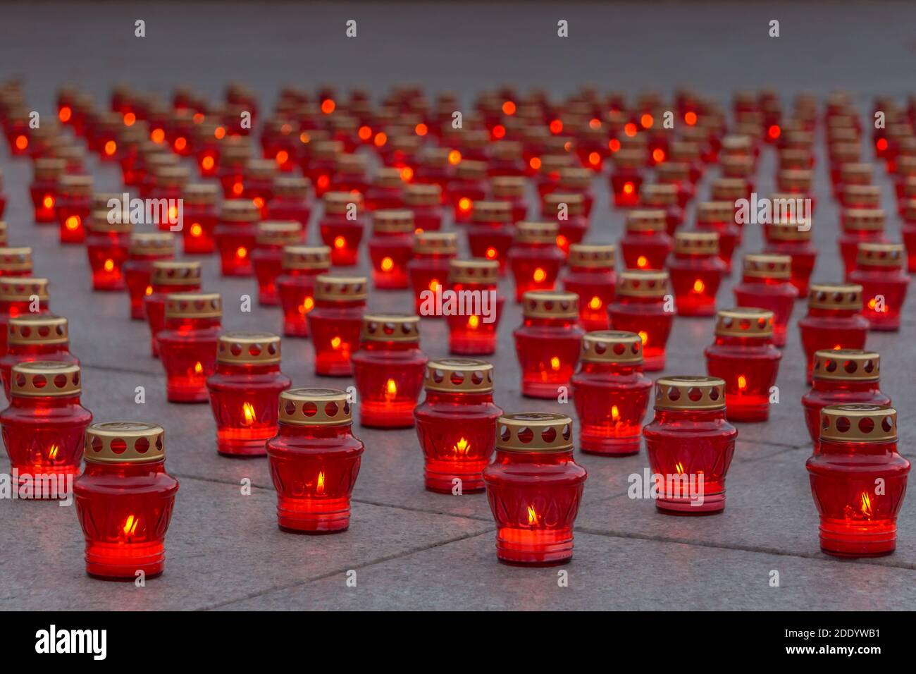 Burning Memorial Red Lantern Candles on granite slabs during Hallowmas ...