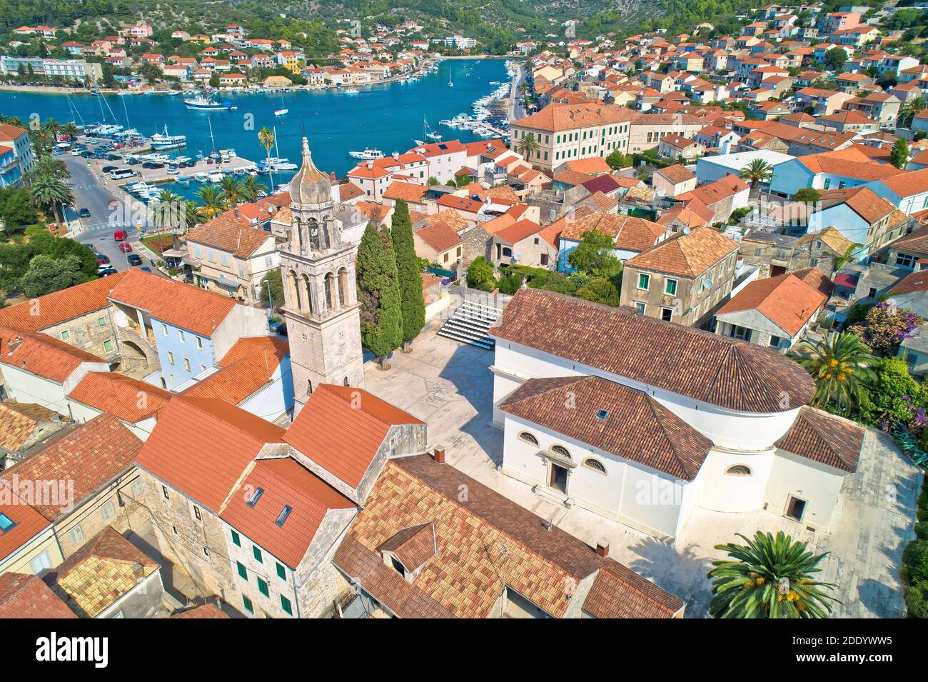 Korcula island. Town of Vela Luka church tower and rooftops aerial view ...