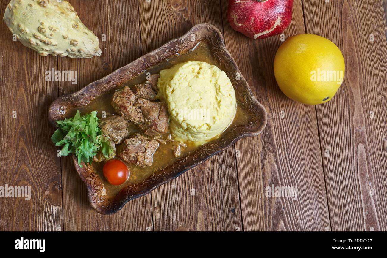 Fungee and Pepperpot - national dish of Antigua and Barbuda, spicy meat ...