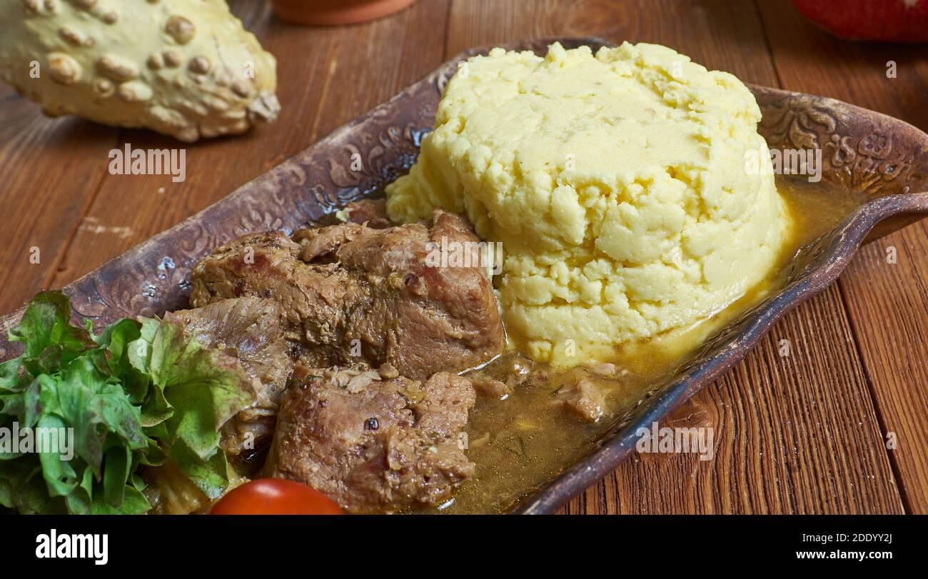 Fungee and Pepperpot - national dish of Antigua and Barbuda, spicy meat ...