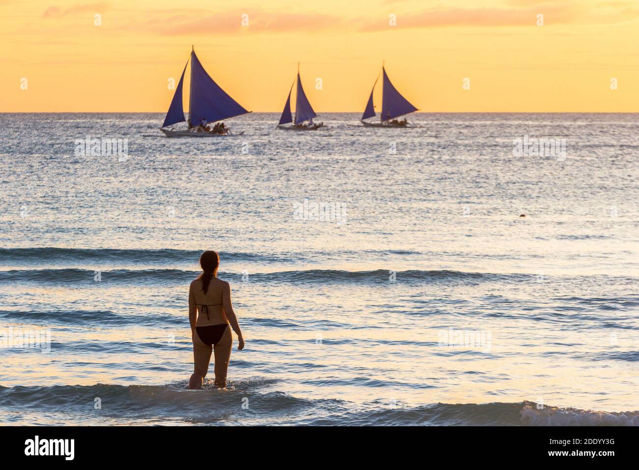 Local sailboats called paraw during afternoon in Boracay, Philippines ...