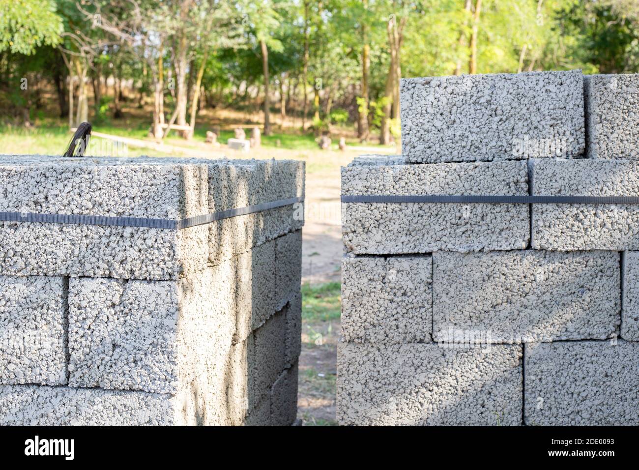 White brick for construction. Cinder blocks stacked on pallets were ...