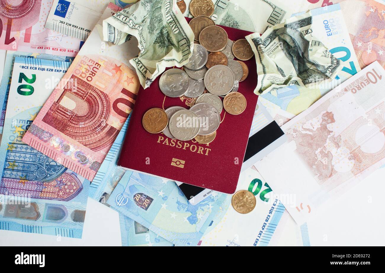 Cash on table isolated: dollars, euro, rubl broken money. All in mess ...