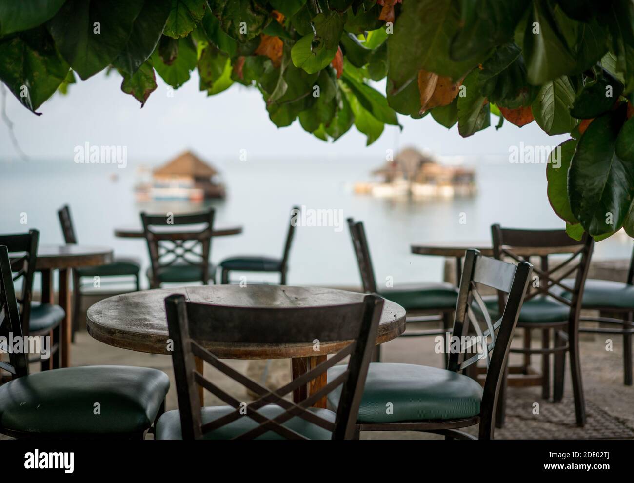Tropical restaurant on beach Stock Photo - Alamy
