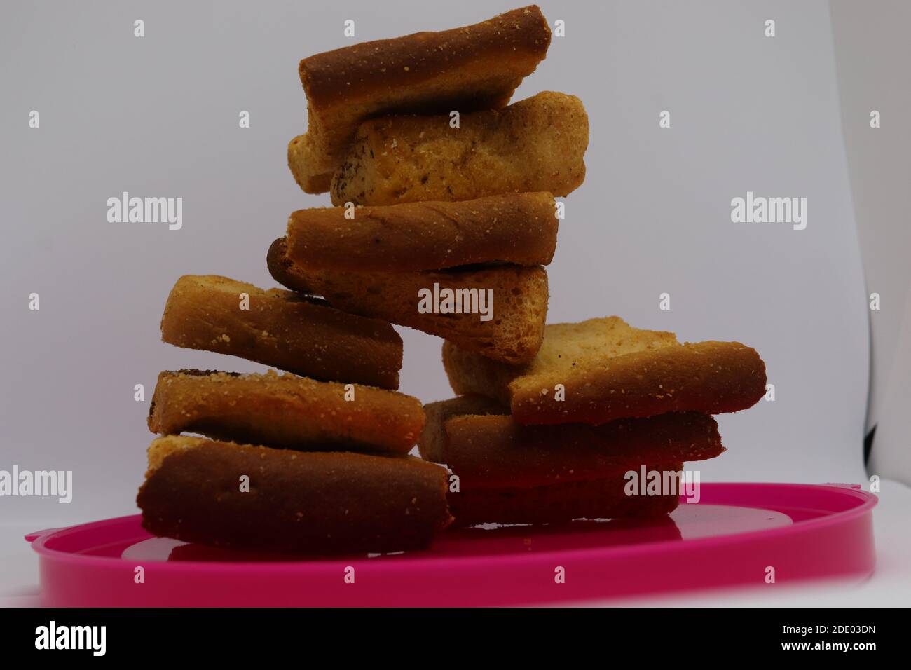 stack of dry toast on Plastics plate. Close Up Pile of toasted bread ...