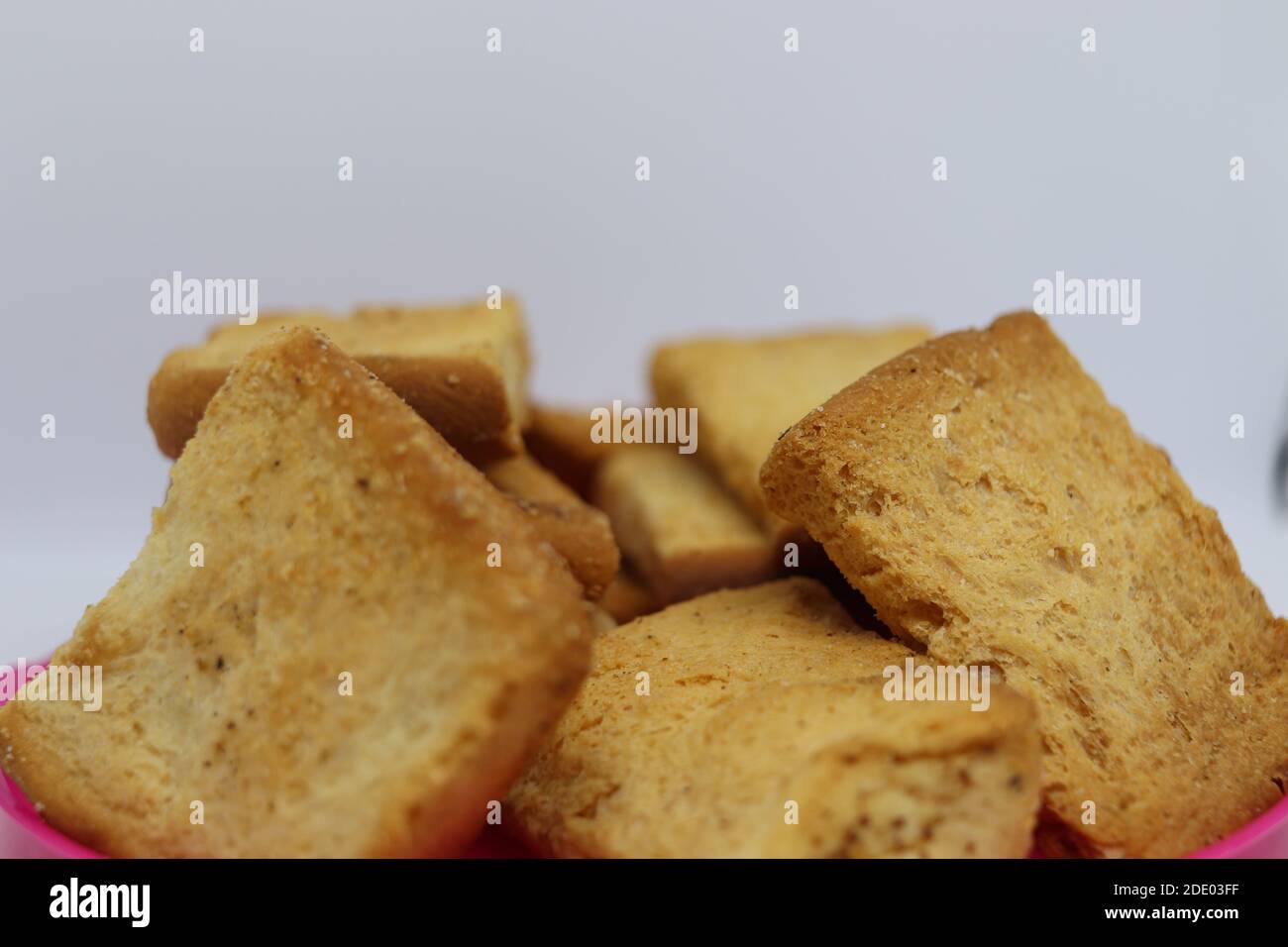 Stack of plain melba toasts on white Background. Edible square dry ...