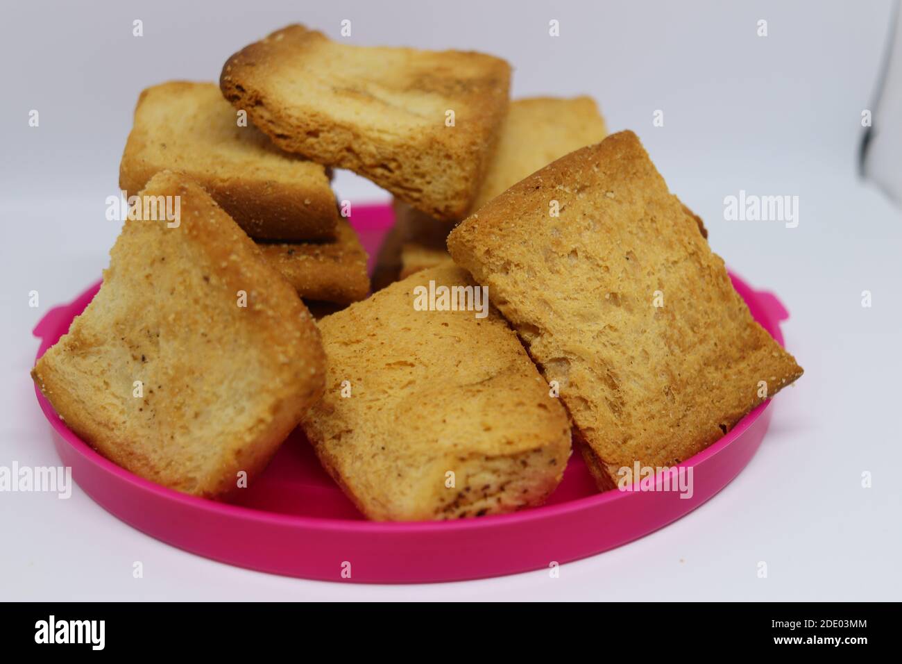 Stack of plain melba toasts on white Background. Edible square dry ...