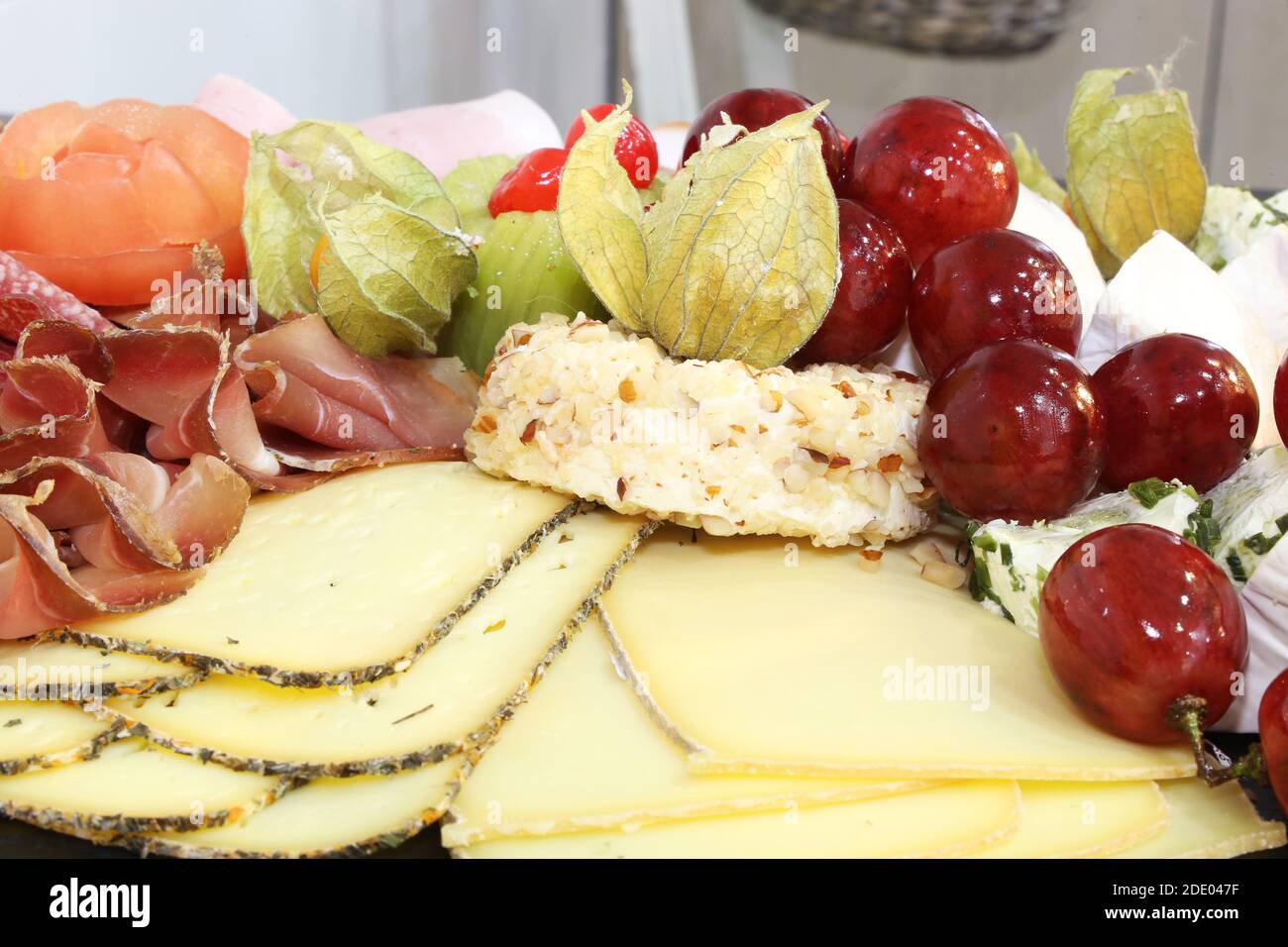 Catering: Cold plate with cheese, ham and grapes Stock Photo - Alamy