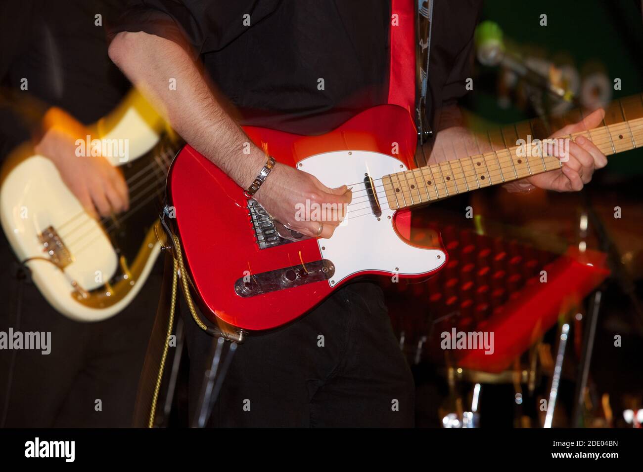 Electric guitars in a rock band on stage Stock Photo - Alamy