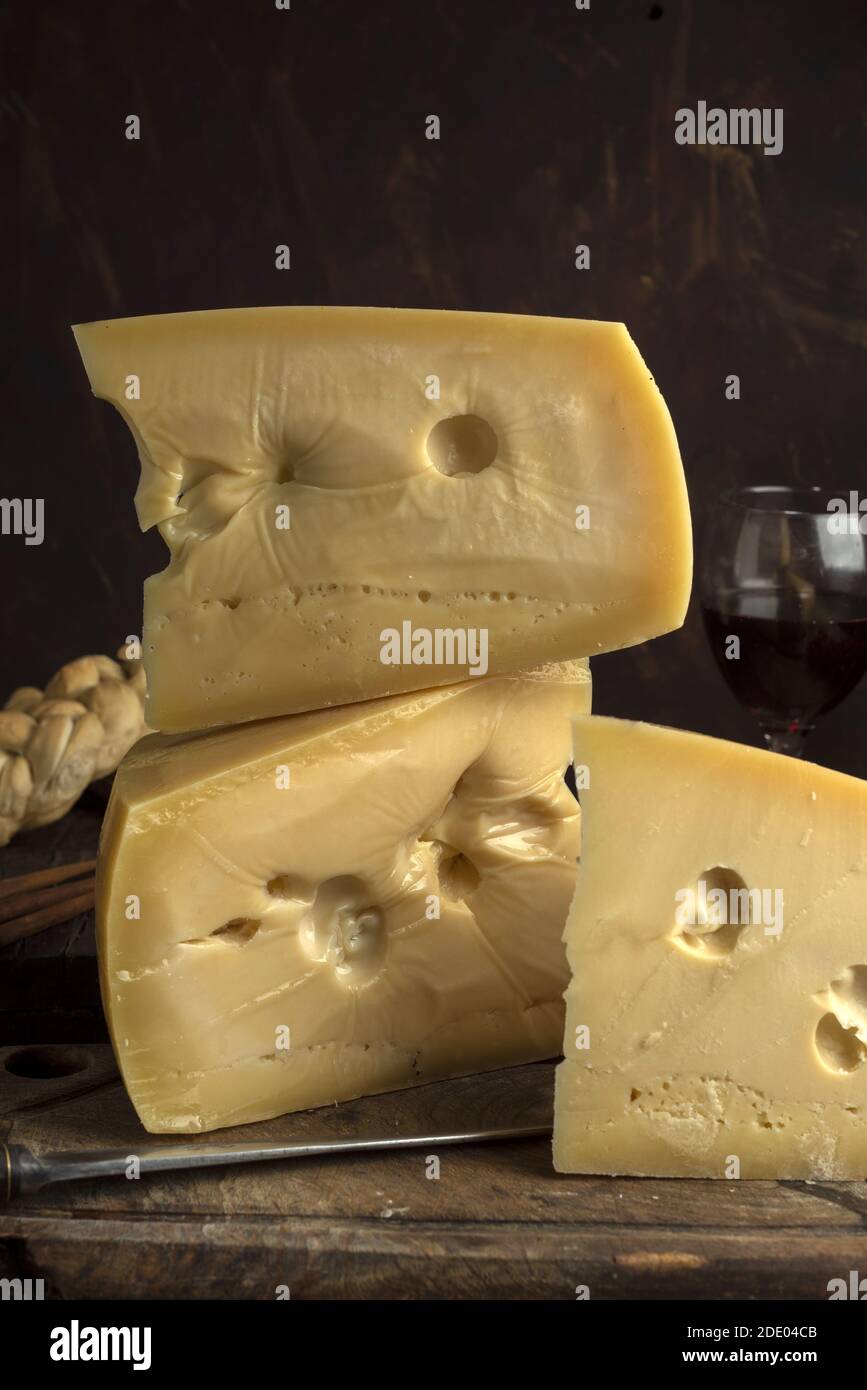 A vertical shot of blocks of delicious swiss cheese Stock Photo - Alamy