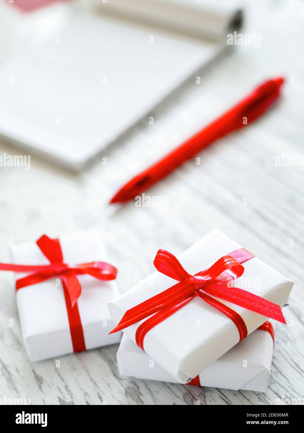 Table with gift boxes, note book. Letter concept. Top view Stock Photo ...