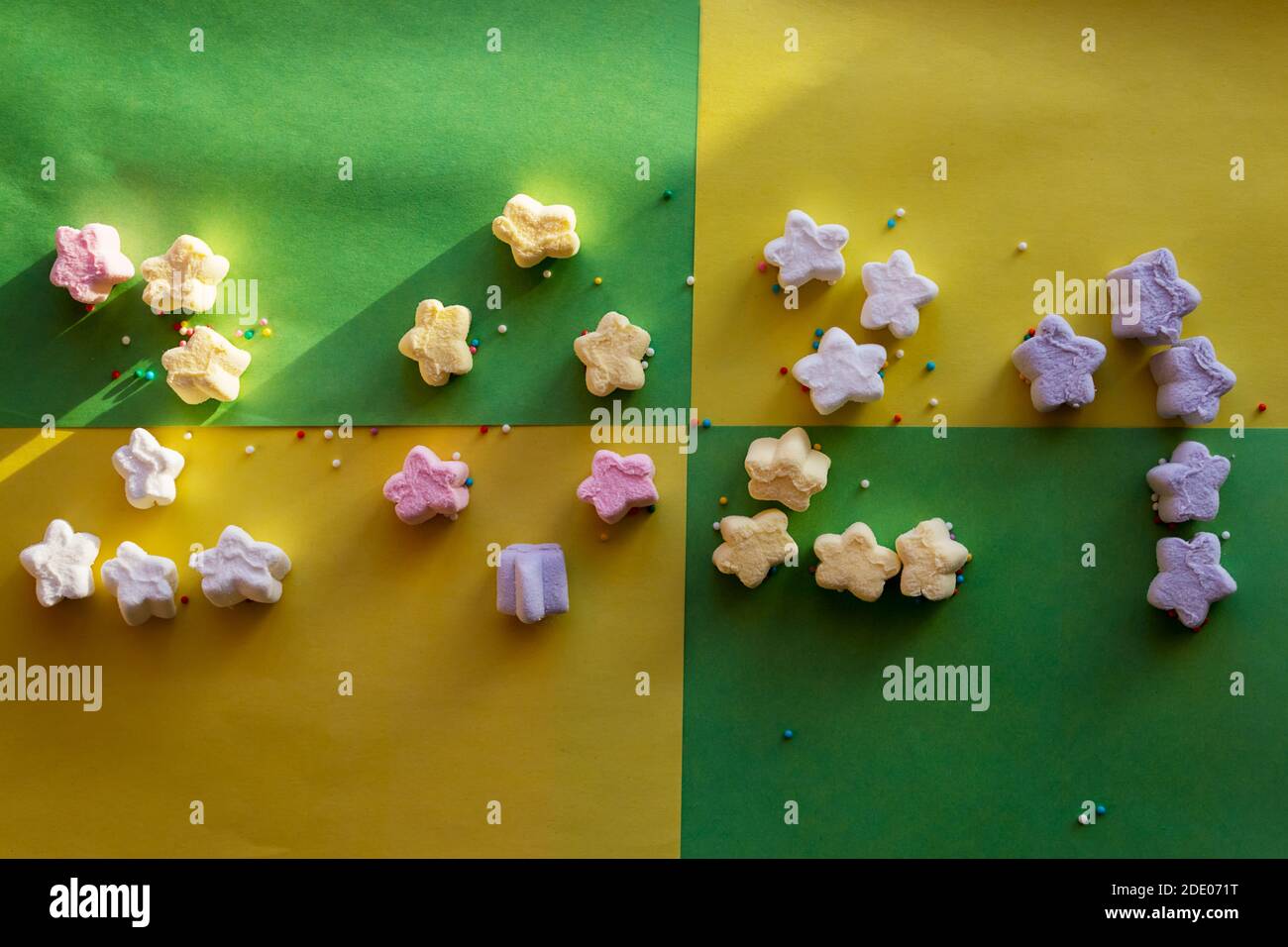 Marshmallow placed on the green-yellow background illustrating number ...