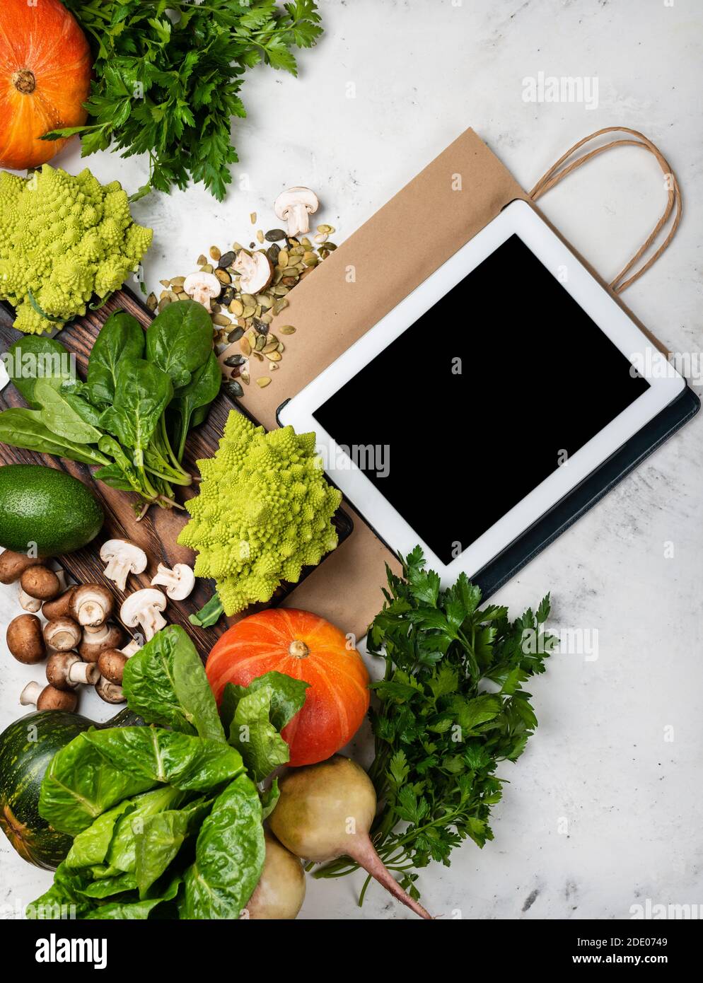 Online grocery shop concept. Tablet computer and shopping paper bag ...