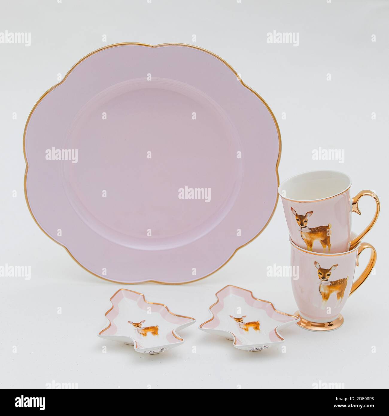 A vertical shot of a plate and cup set on a white background Stock ...
