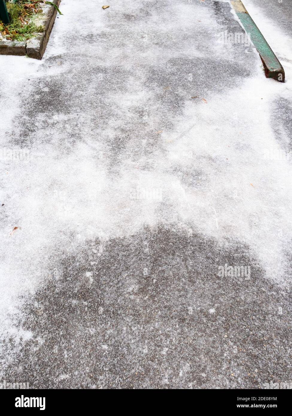 ice-covered slippery asphalt sidewalk in city after freezing rain on ...