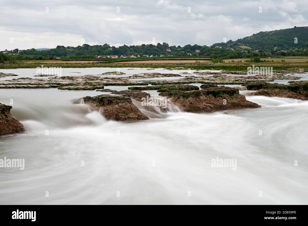 Water draining from the salt marshes at Porlock on the Somerset Coast ...