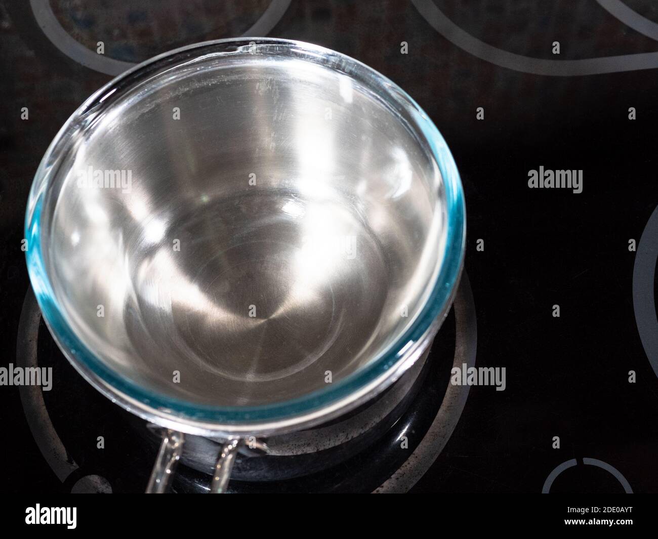cooking sweet sponge cake at home - above view saucepot of water and ...