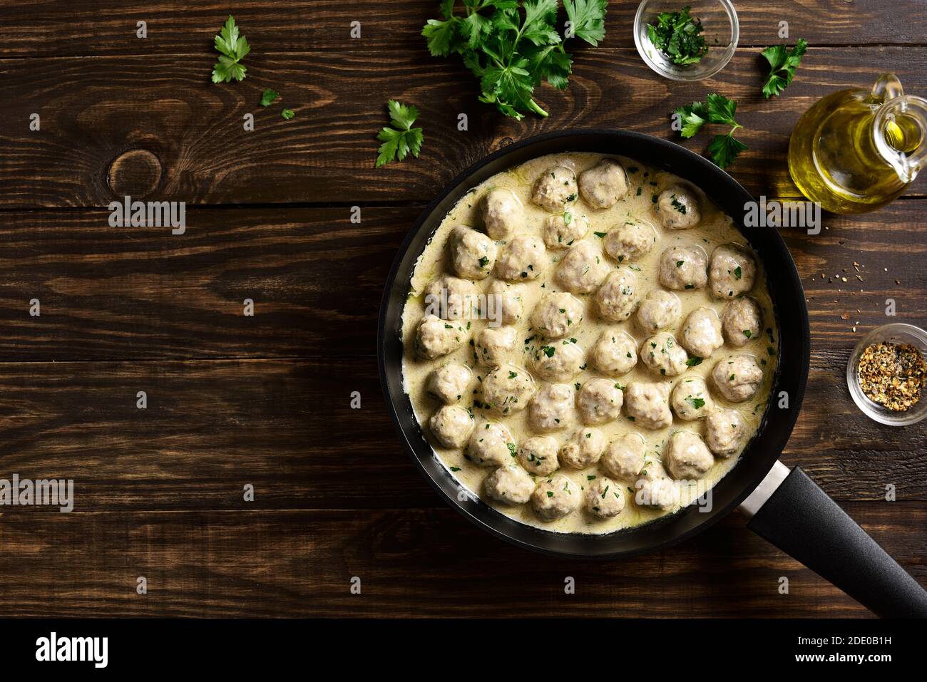 Delicious homemade swedish meatballs with creamy white sauce in frying ...