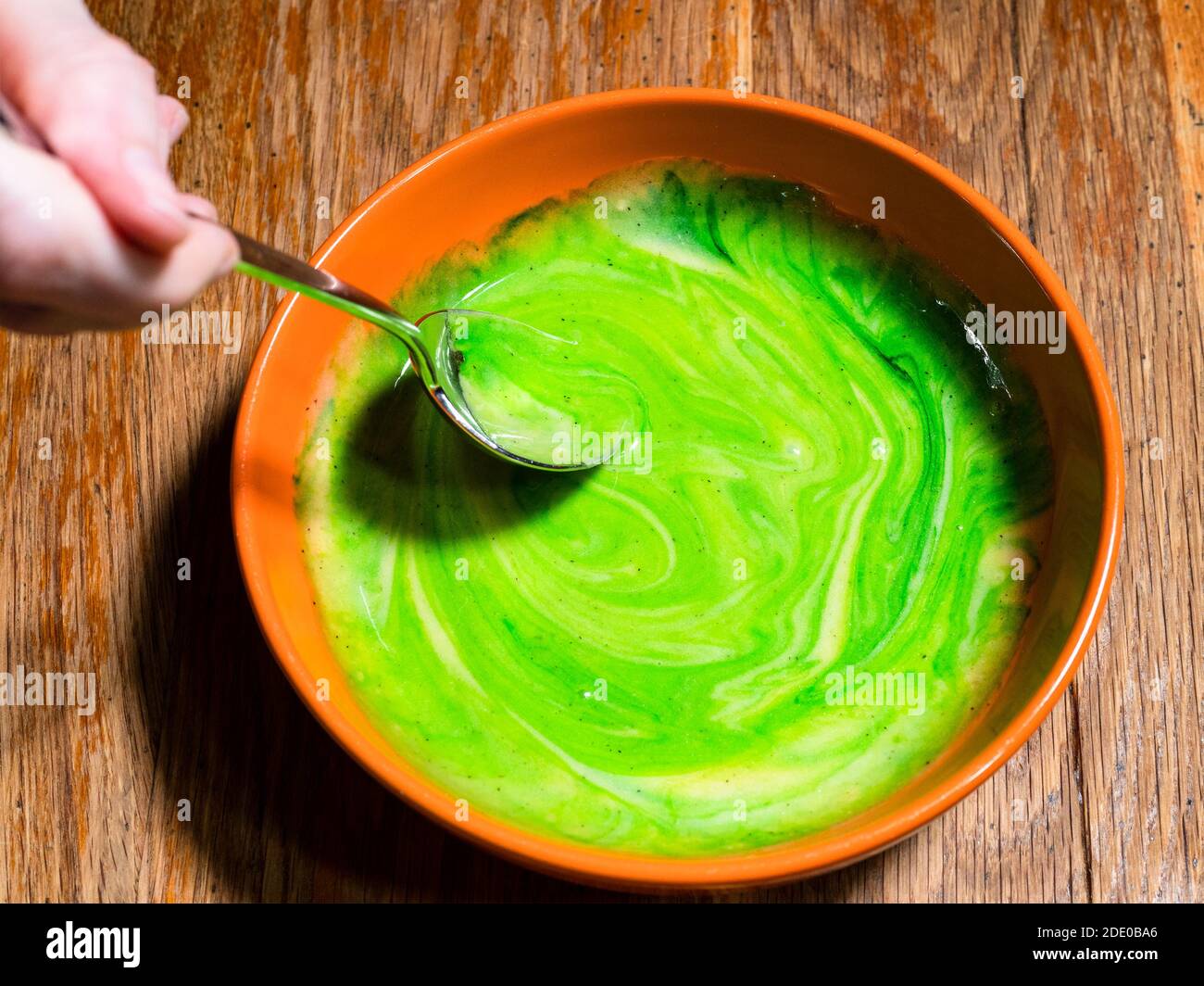 cooking sweet sponge cake at home - top view of mixing green food ...