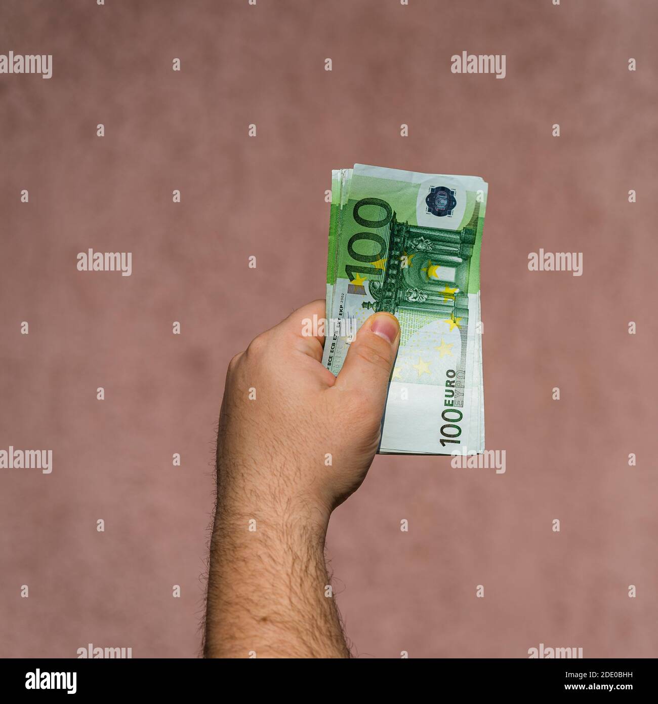 Hand holding and showing euro money or giving money. World money ...