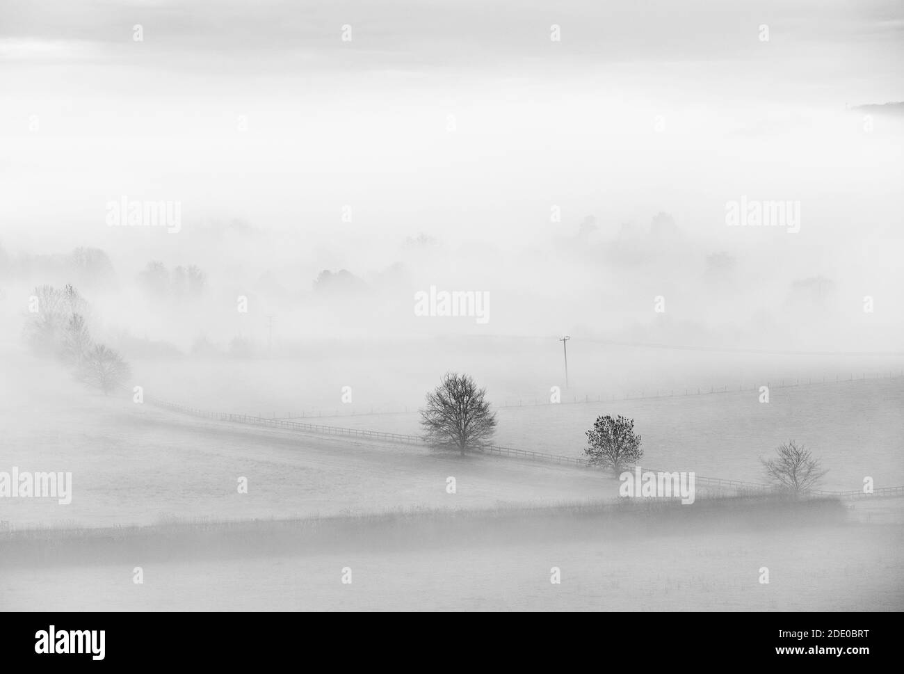Early morning mist rolling through English countryside Stock Photo - Alamy