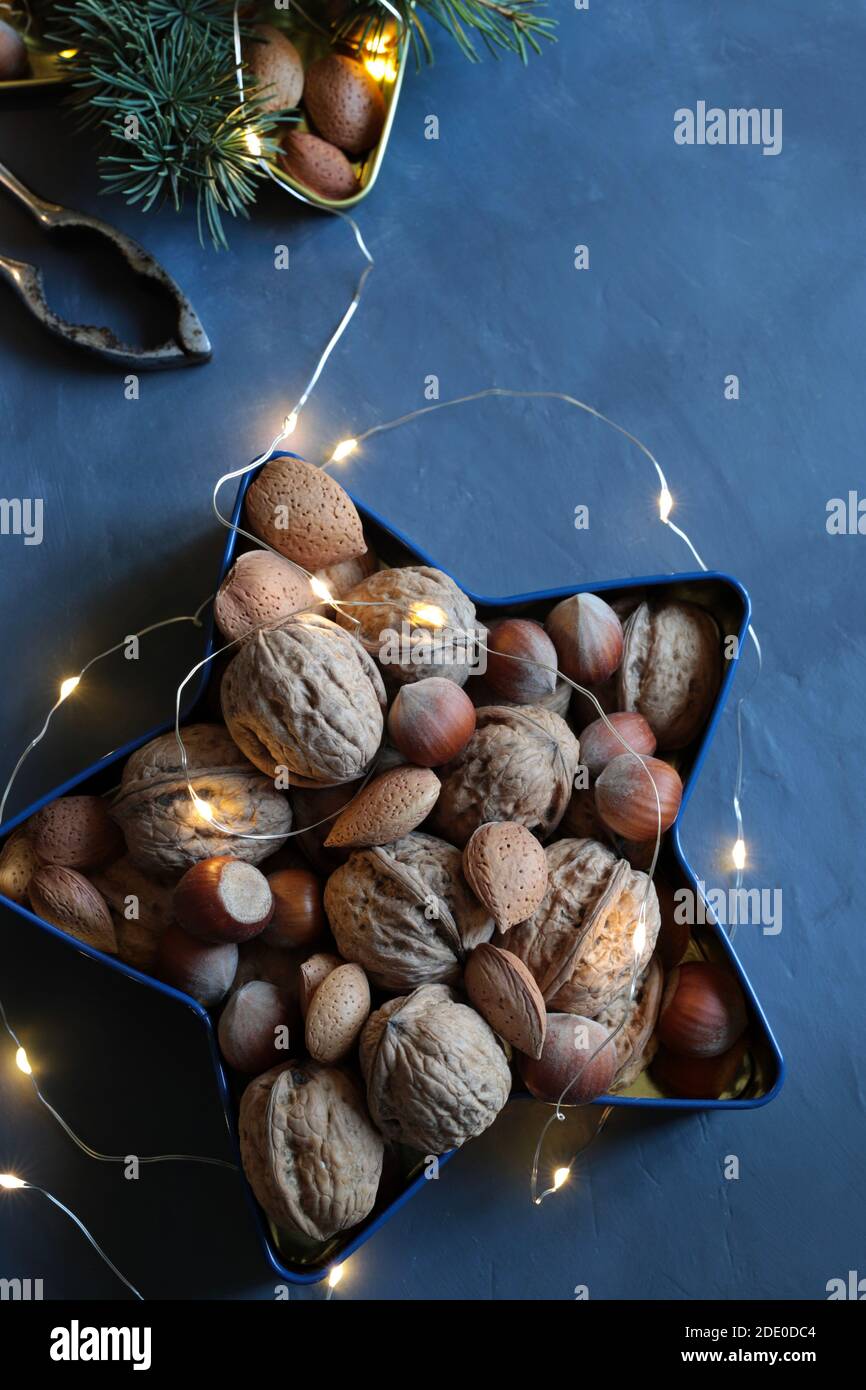 Dry fruits in shell. Christmas light Stock Photo - Alamy