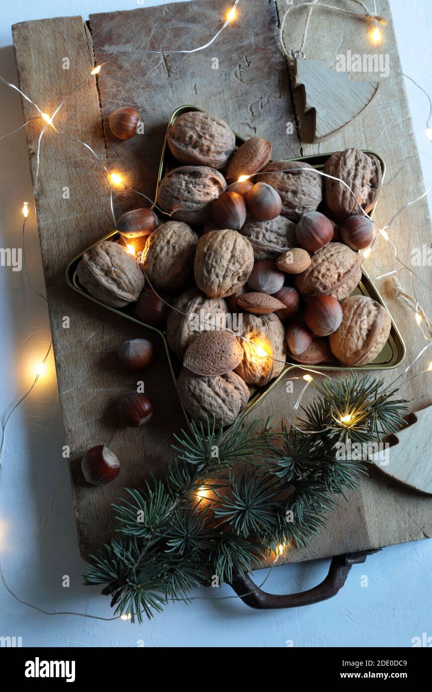 Dry fruits in shell. Christmas light Stock Photo - Alamy