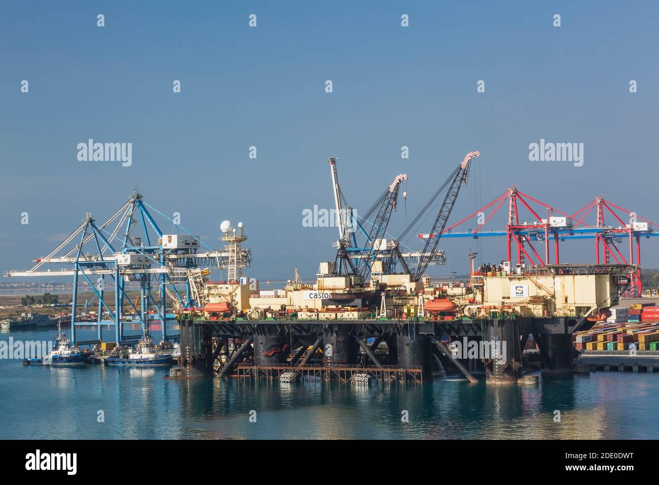 Dock with gantry cranes and docked underwater oil and gas pipeline ...