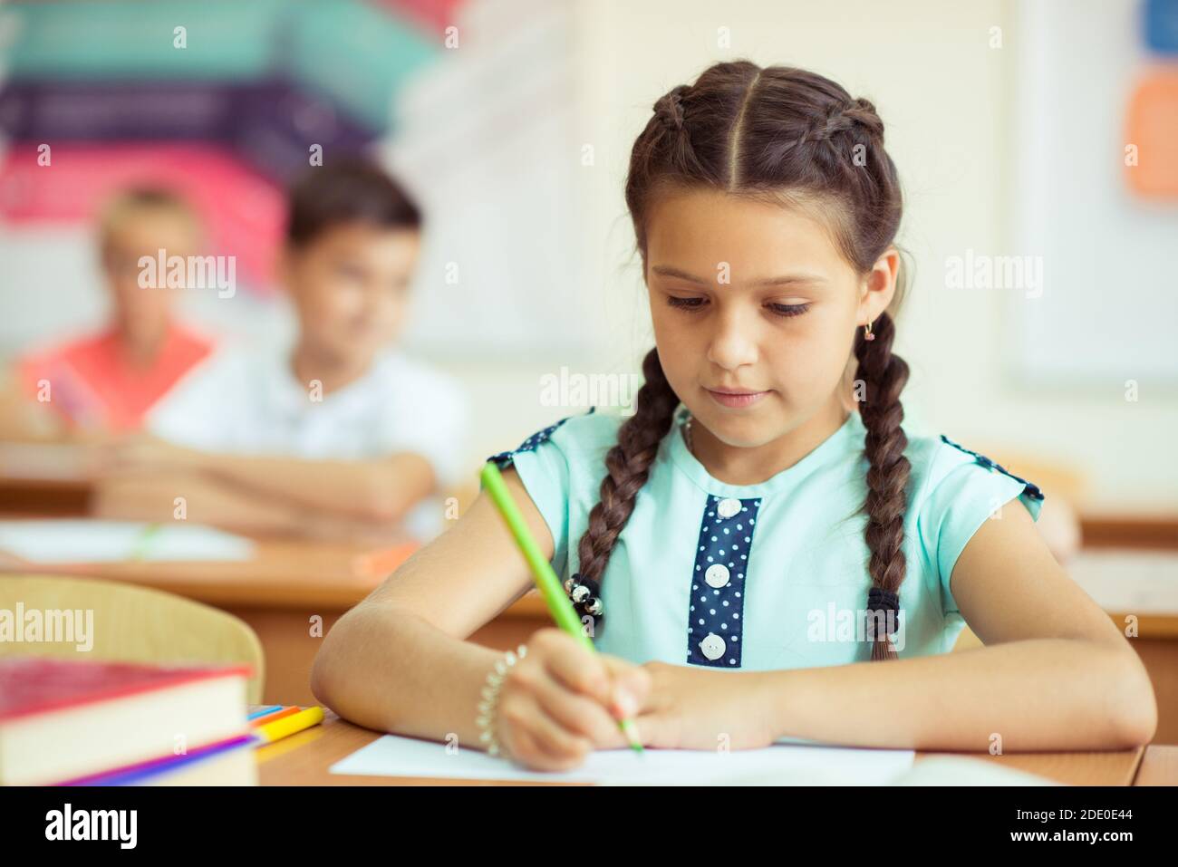 Portrait of children studying in classroom at the school Stock Photo ...