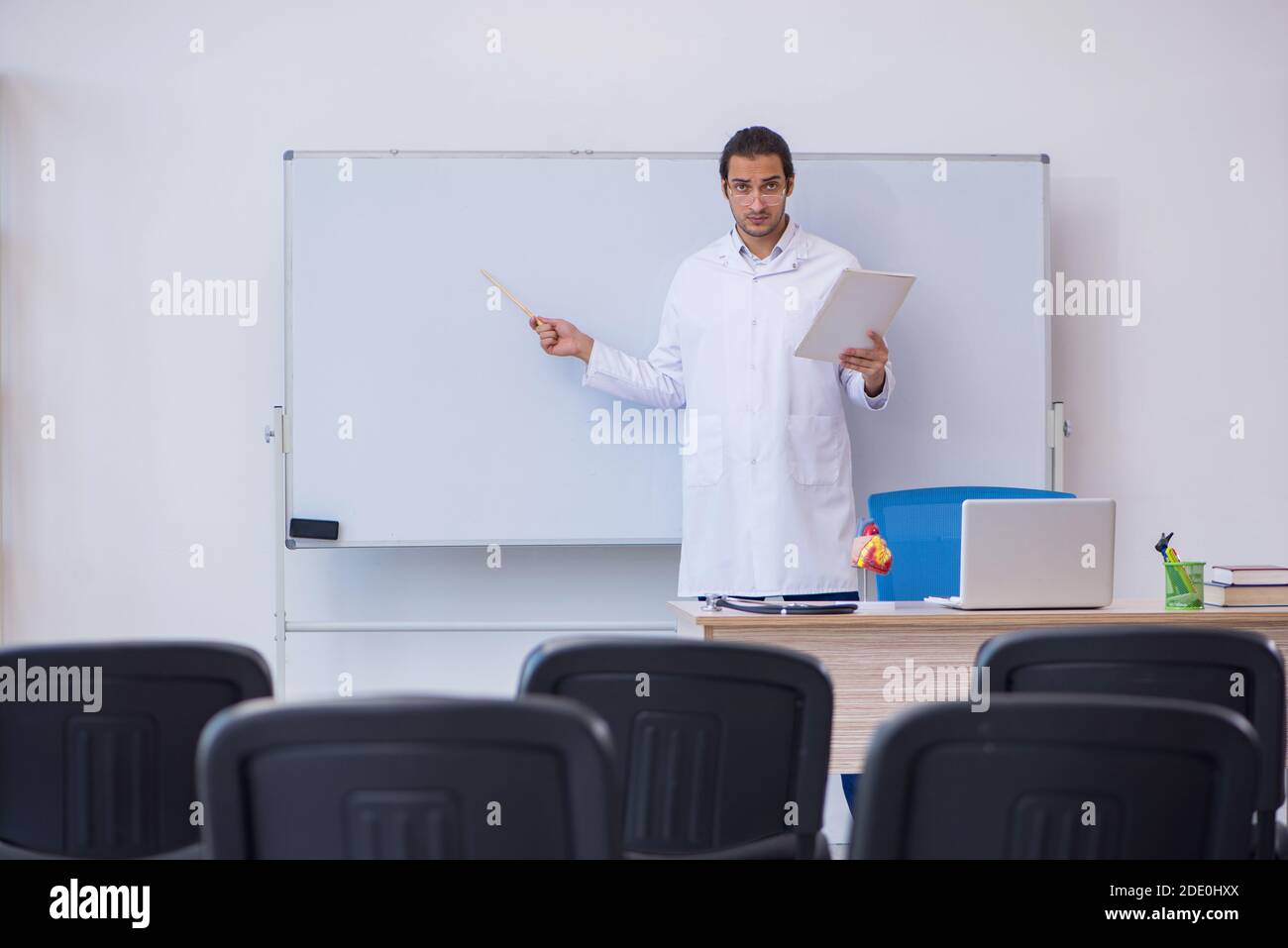 Young doctor giving seminar in the classroom Stock Photo - Alamy