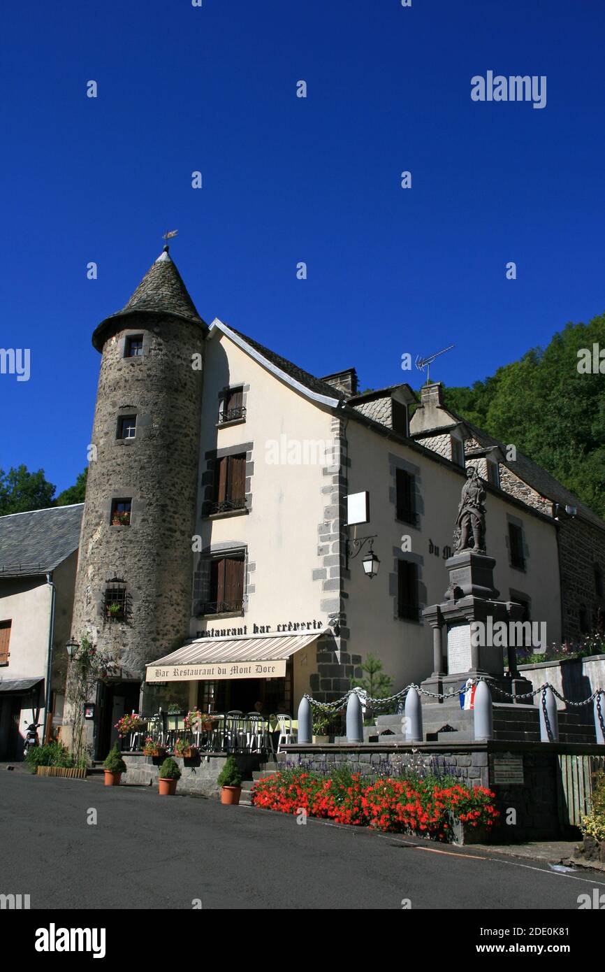 medieval tower and war memorial in orcival in auvergne (france Stock ...