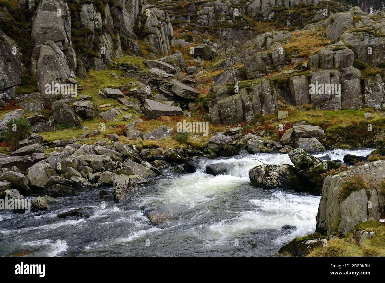 Shown here is the rocky terrain in the Nant Ffrancon valley situated ...
