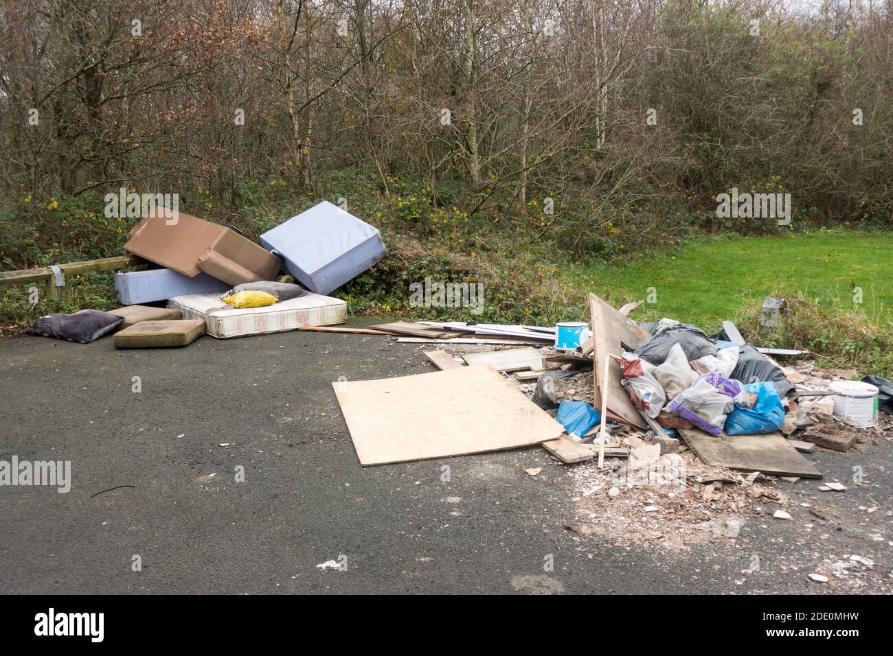 Builder's waste and household furniture fly tipped in countryside car ...