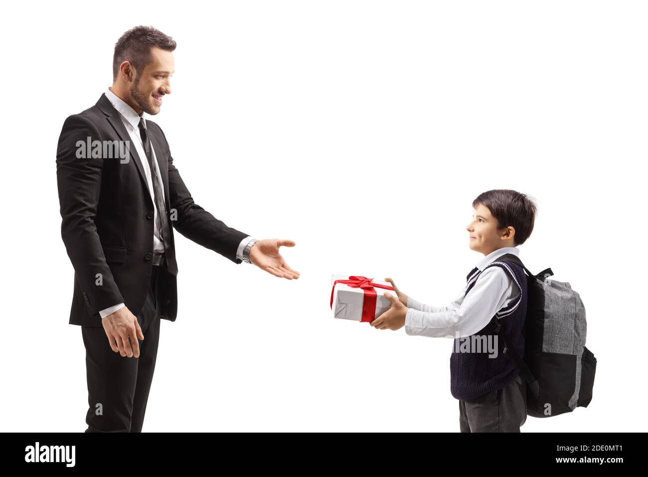 Boy giving a present to his father isolated on white background Stock ...